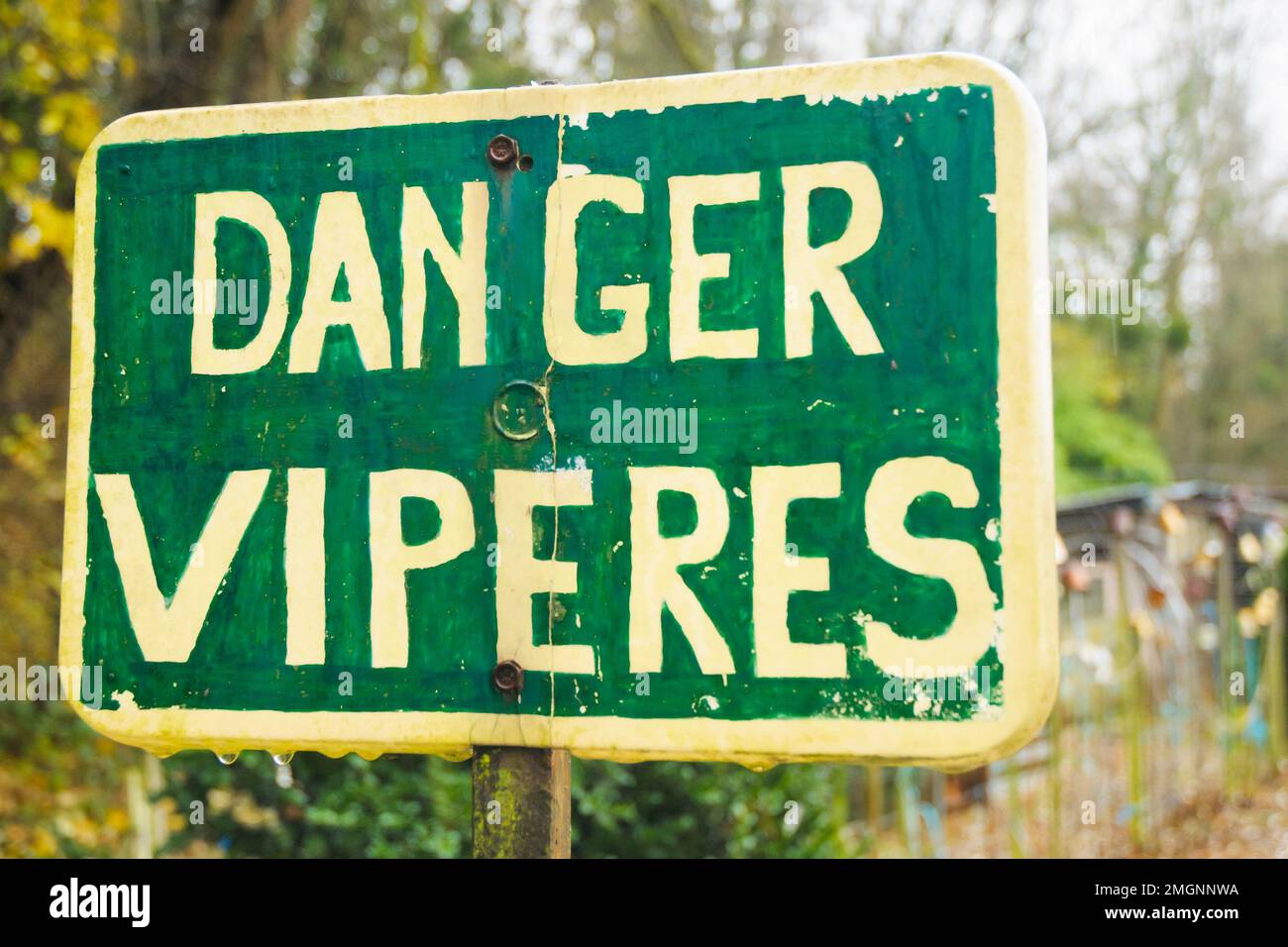 'Danger vipers' sign at the edge of a small stream and allotments ...