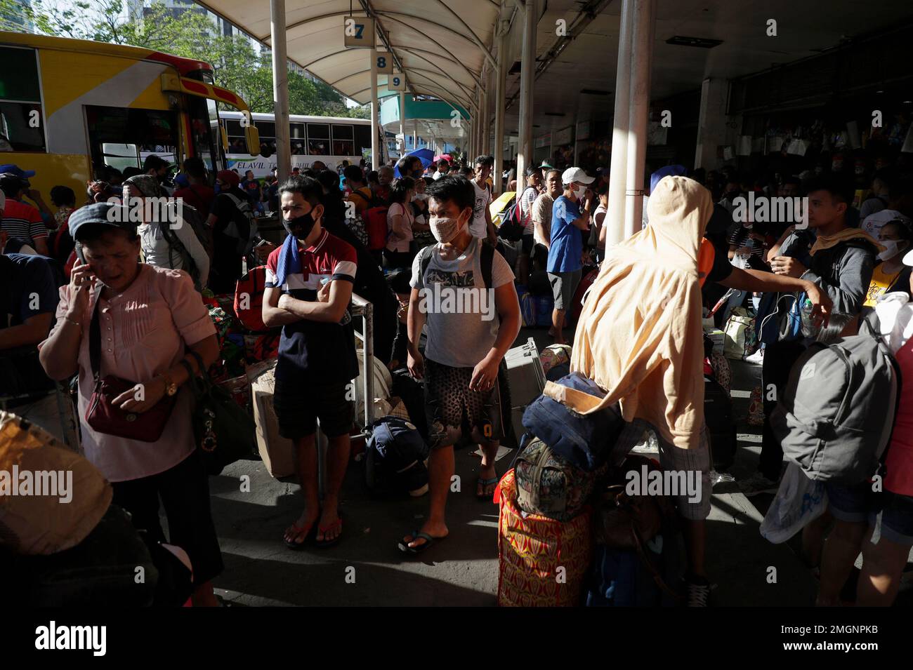Passengers wait at a crowded Cubao bus terminal in Manila, Philippines ...