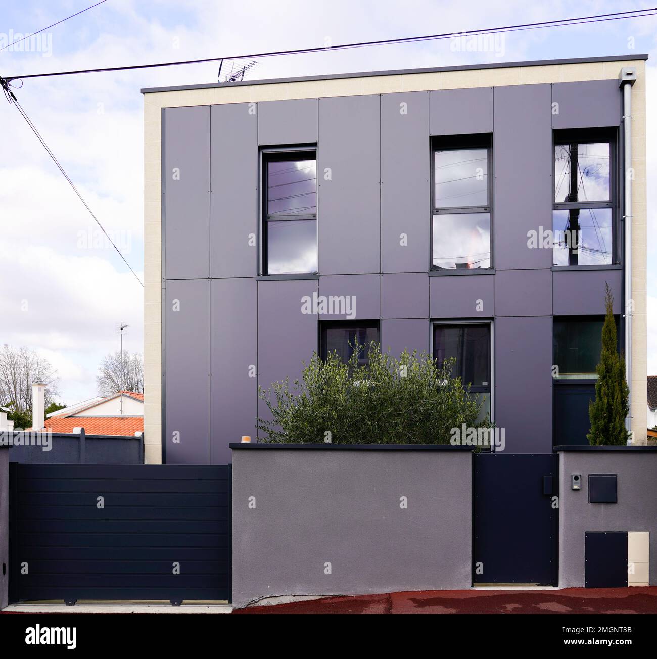 Modern house facade square with garage portal entrance Stock Photo - Alamy