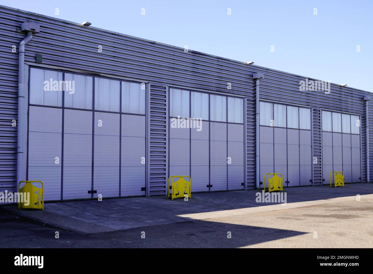 warehouse industrial building Exterior facade with semi truck loading ...