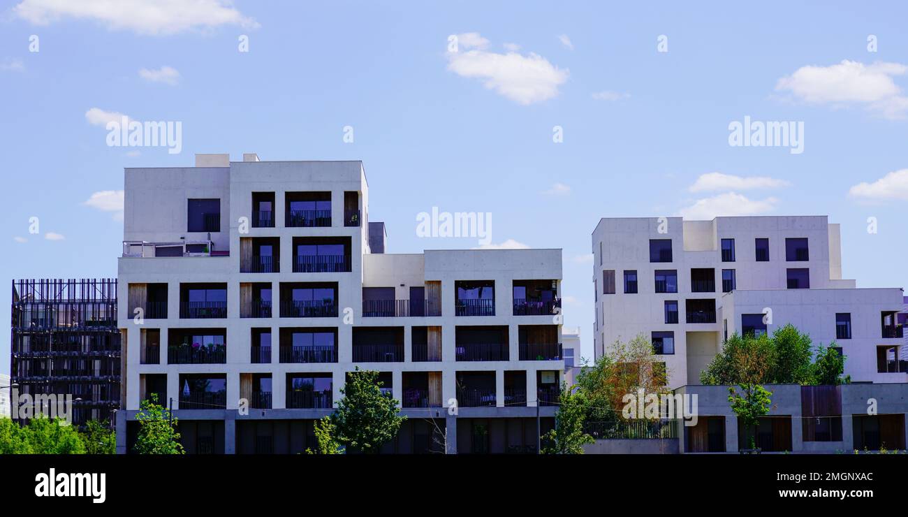 new modern white facade line building with balcony and terrace in blue ...