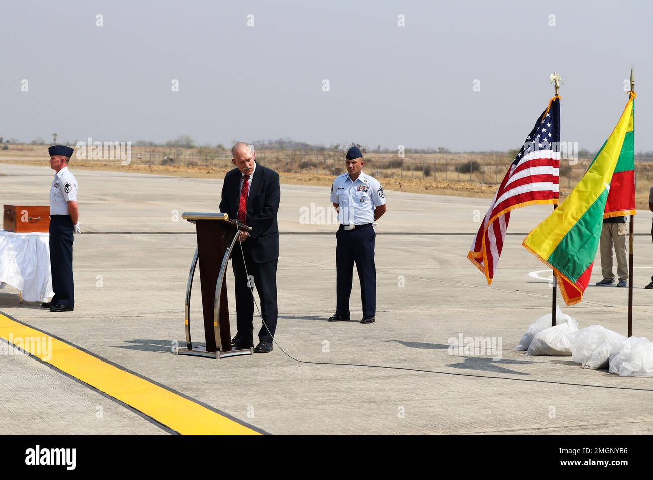 U.S. Embassy’s Deputy Chief of Mission George Sibley, center, speaks ...