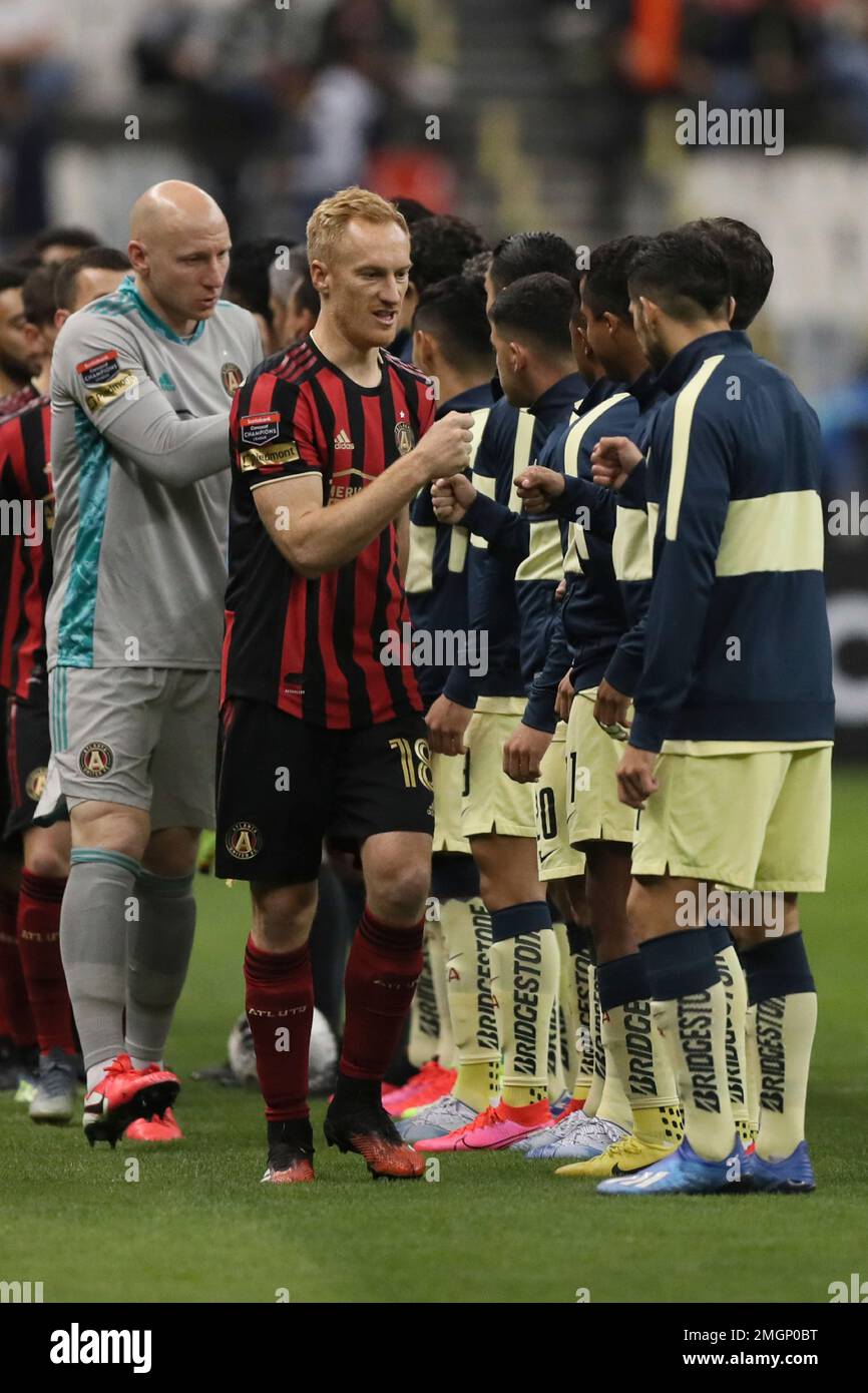 Jeff Larentowicz of Atlanta United, center, gets fist-bumps from ...