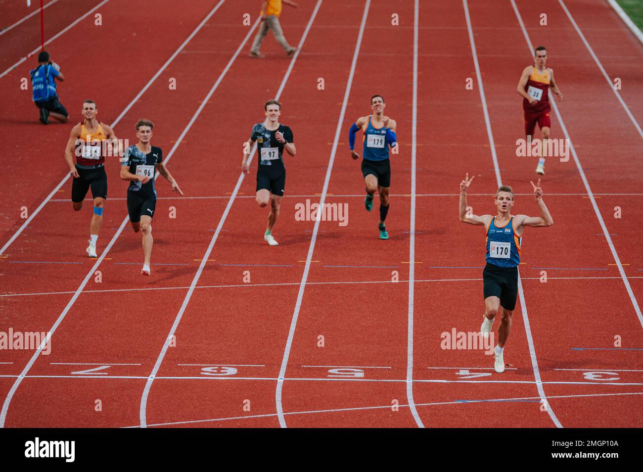 MARTIN, SLOVAKIA, 16 JULY, 2022: Male athletes captured in motion as ...