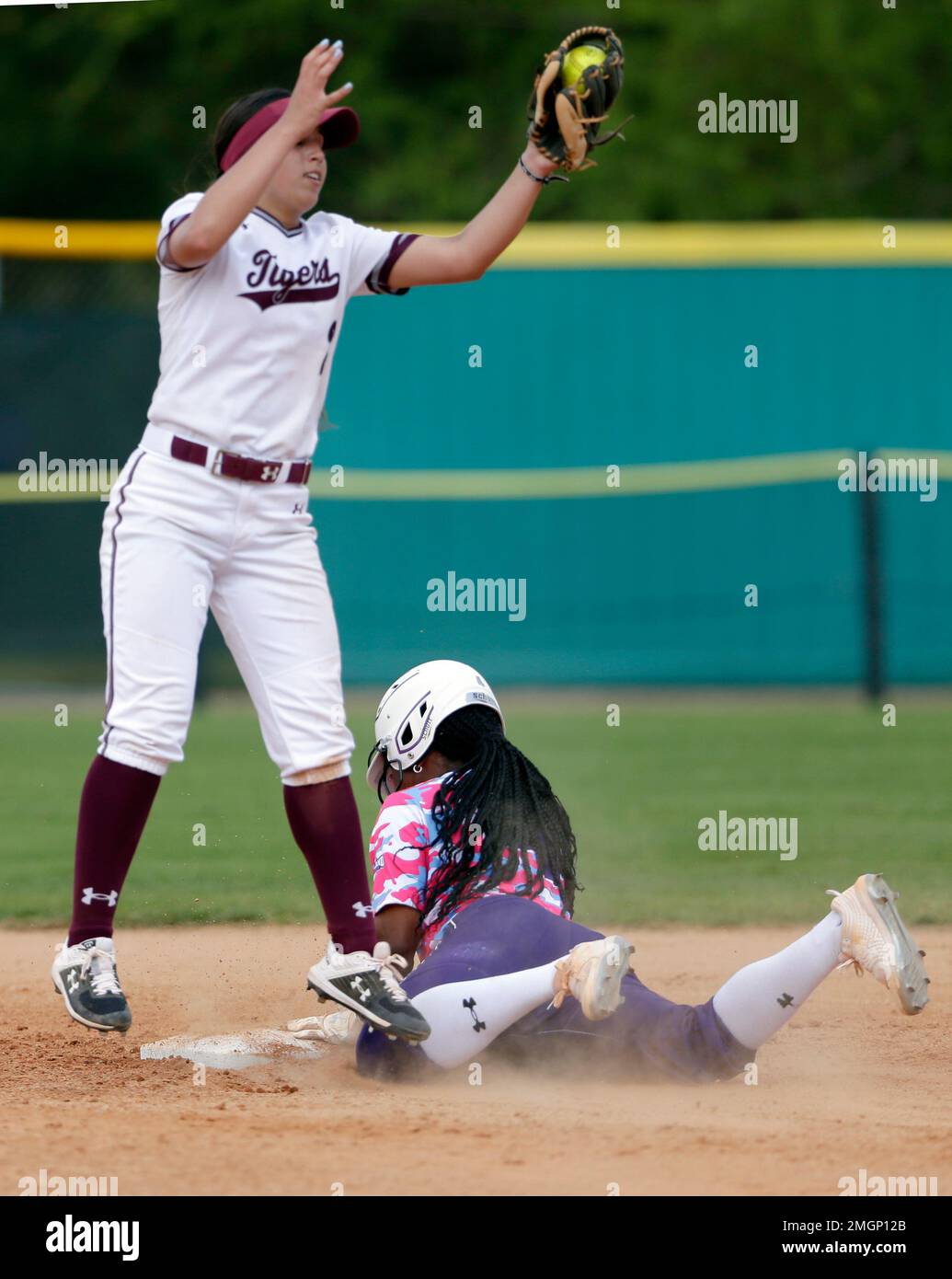 Stephen F. Austin's Alex Hedspeth, right, is safe at second base as ...
