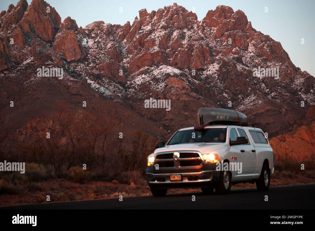 In this Wdnesday, March 4, 2020, photograph, the setting sun turns red ...
