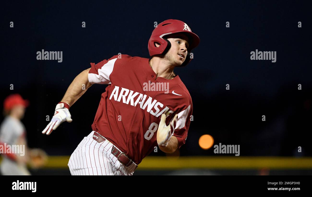 Arkansas baserunner Braydon Webbrounds third base against Illinois ...