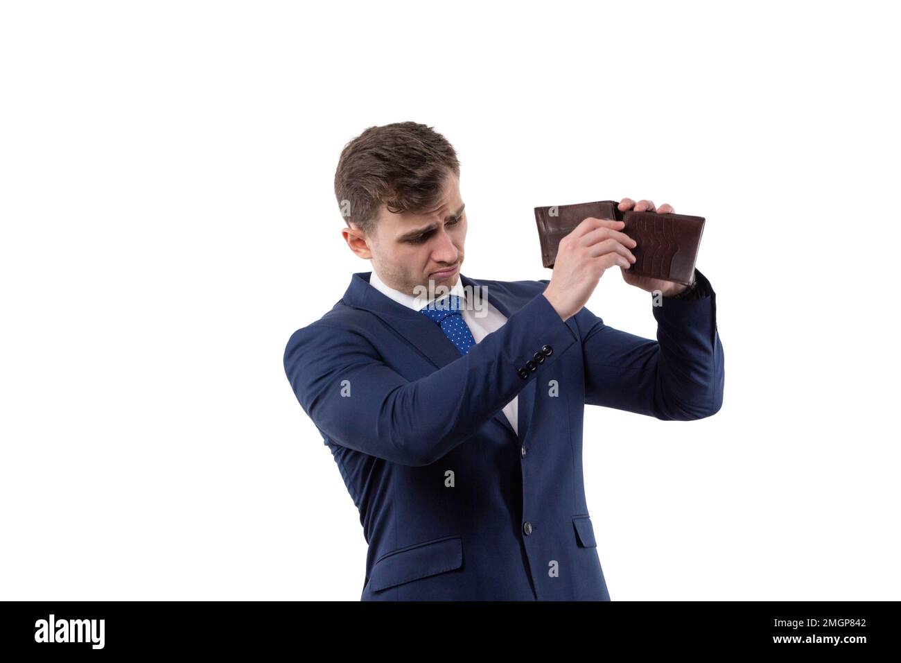 Handsome man in a suit turns over an empty wallet. Financial crisis and ...