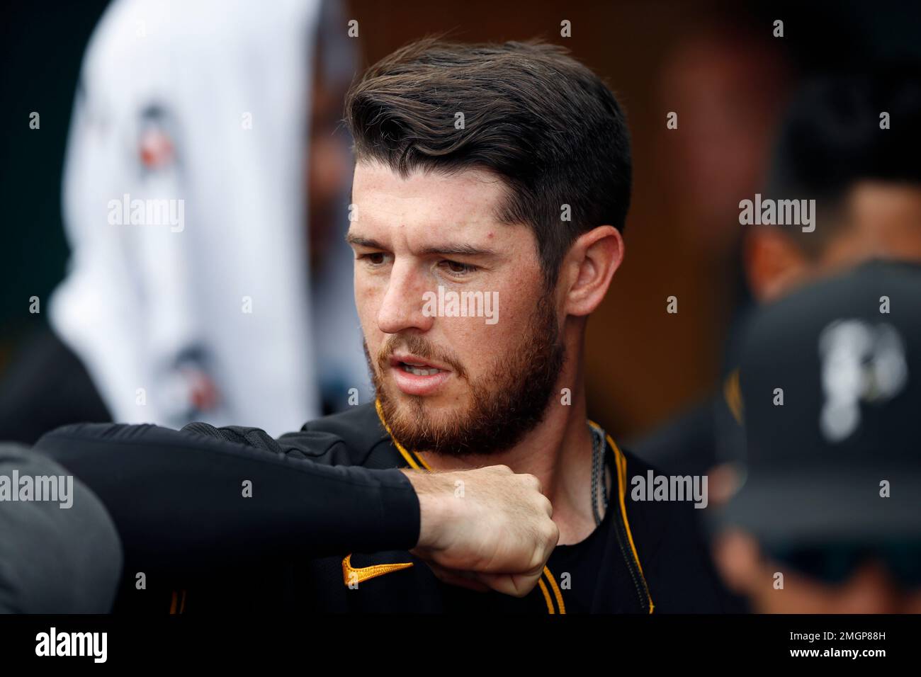 Pittsburgh Pirates' JT Riddle elbow bumps teammates in the dugout after ...