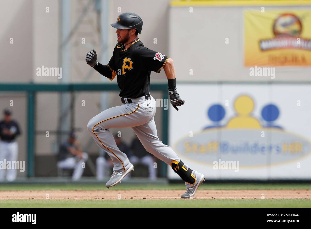 Pittsburgh Pirates' JT Riddle heads to third during a spring training ...