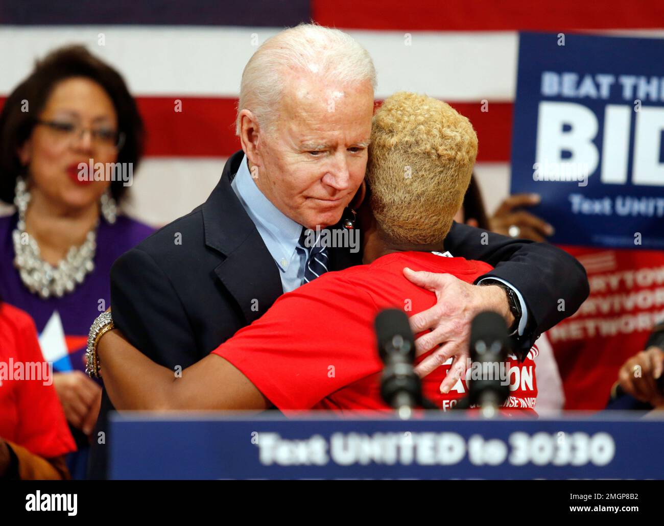 Democratic presidential candidate former Vice President Joe Biden hugs ...