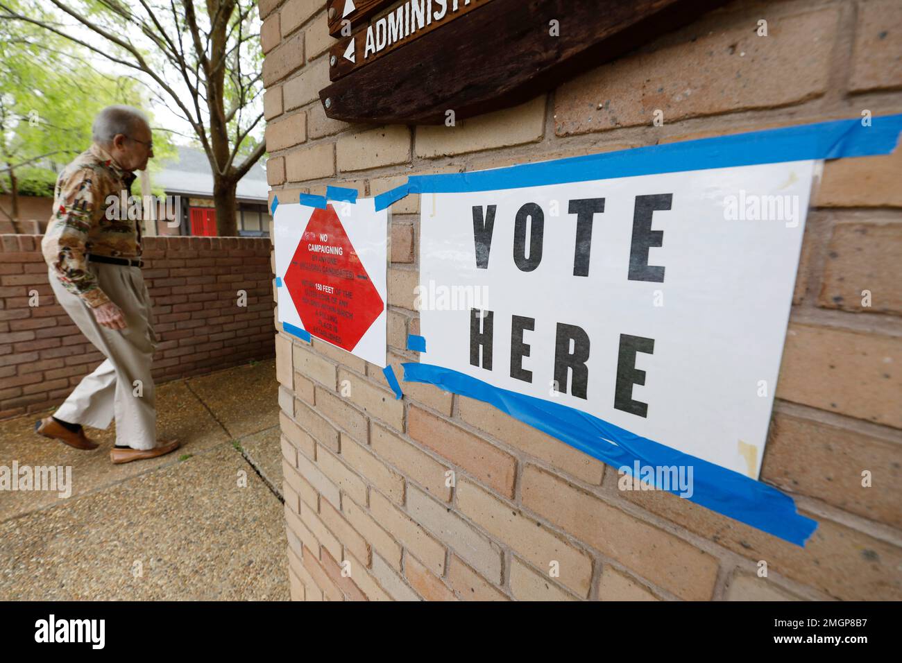 A voter walks into a Jackson, Miss., precinct, Tuesday, March 10, 2020 ...