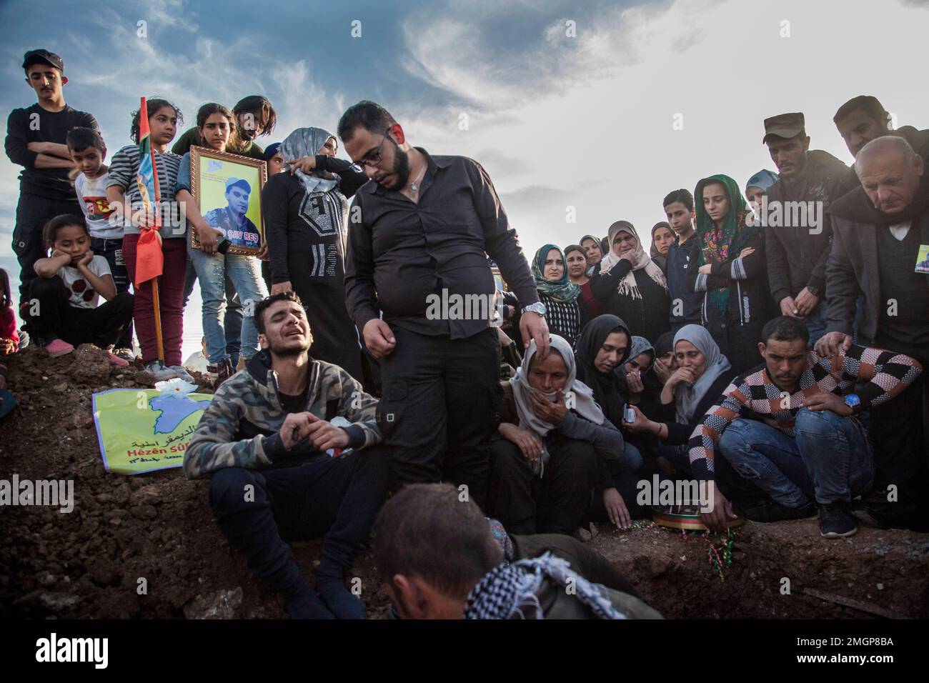 People attend a funeral of Syrian Democratic Forces fighter who was ...