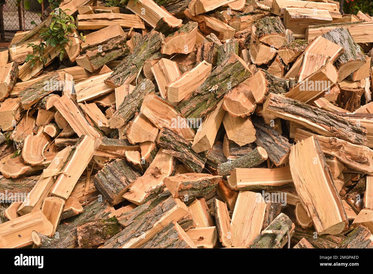 Natural fuel for heating the house. Firewood background Stock Photo - Alamy