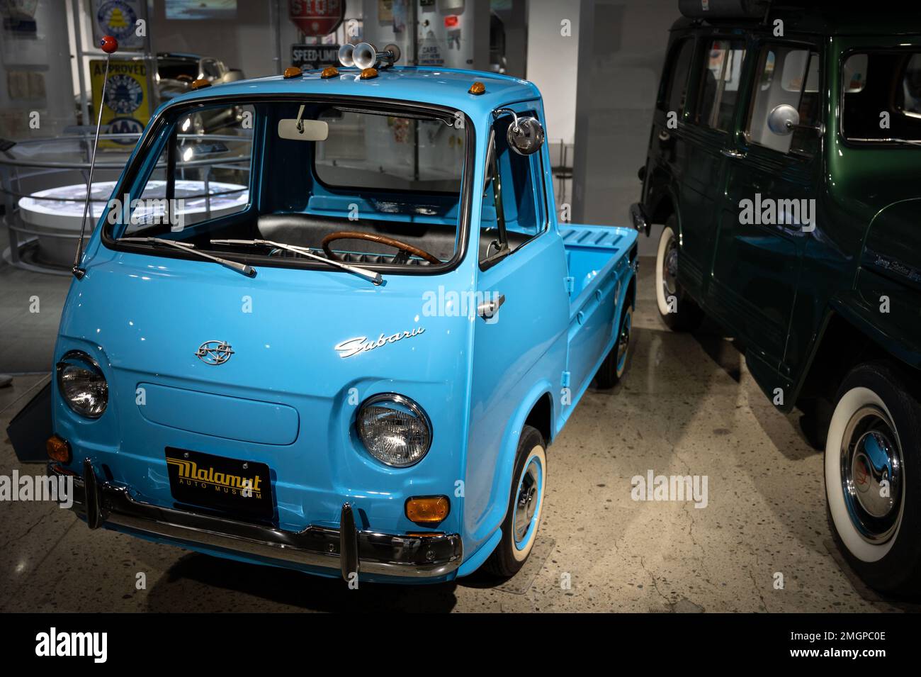 old tiny blue pickup truck, it is a second generation Subaru Sambar ...