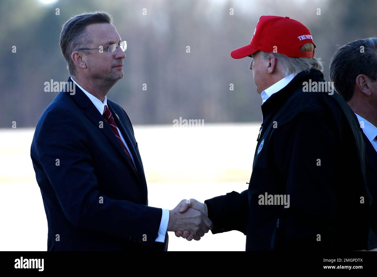 President Donald Trump greets Rep. Doug Collins, R-Ga., as he arrives ...