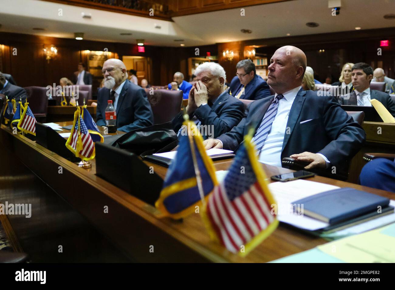 Speaker of the House Brian Bosma, R-Indianapolis, right, sits in the ...