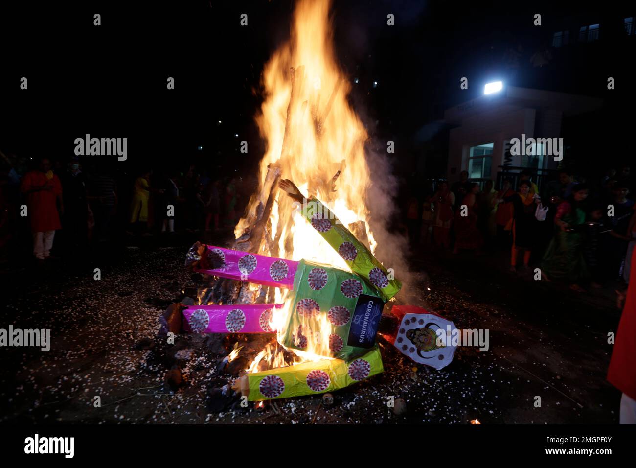 Indians burn an effigy of Corona virus during Holi festival ...