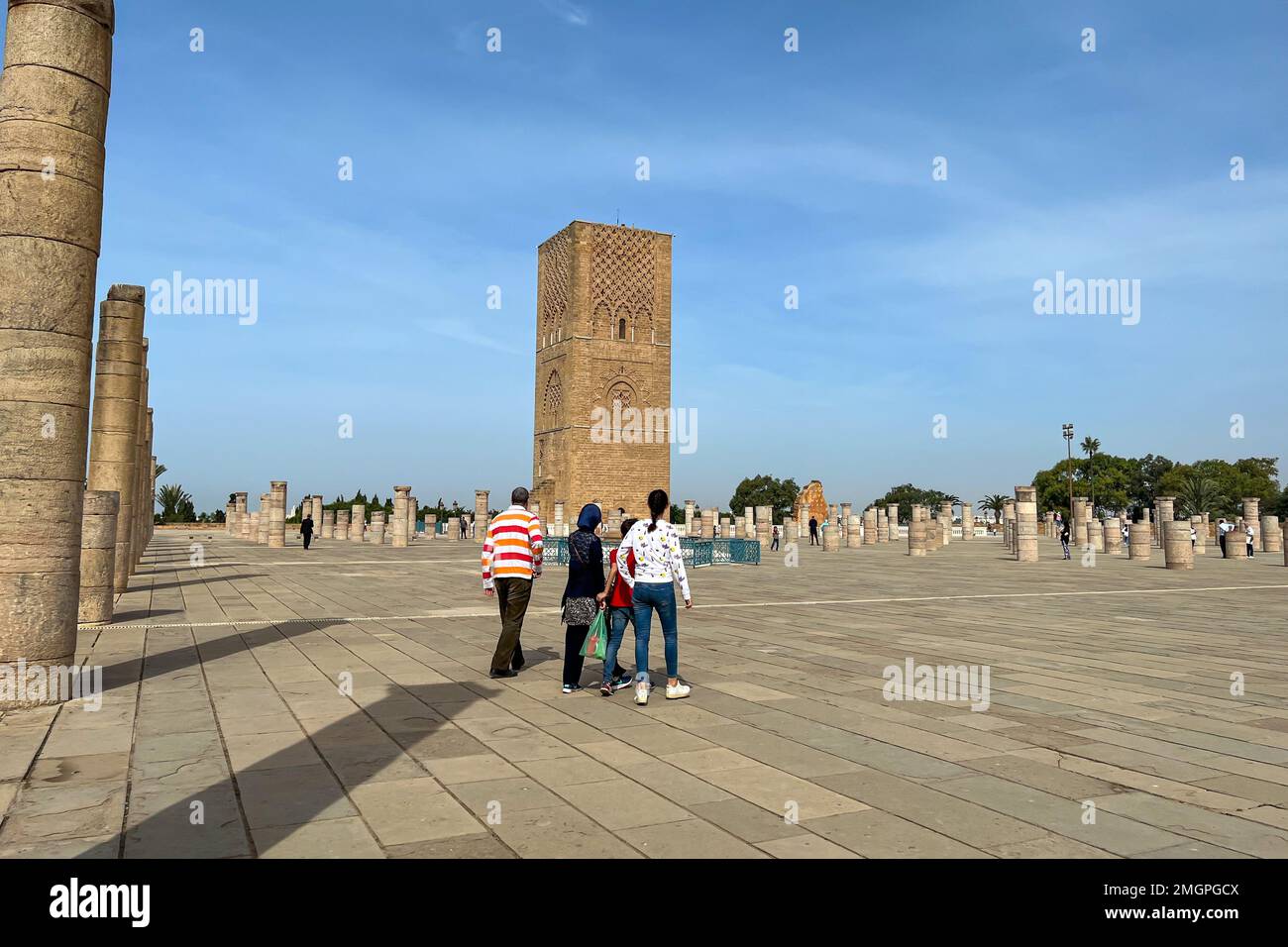 People visiting the Hassan Tower and the columns in Rabat, Morocco ...