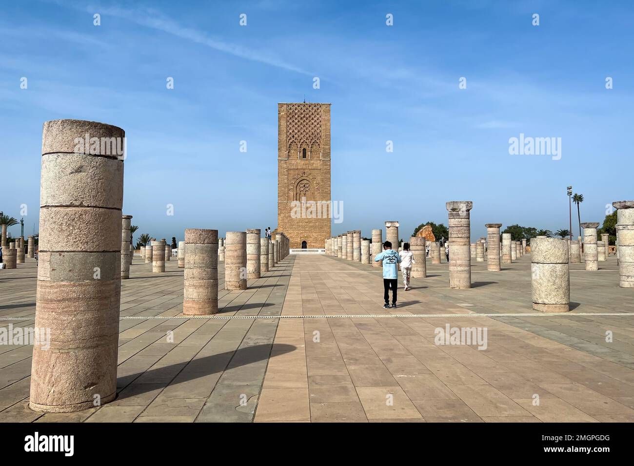 People visiting the Hassan Tower and the columns in Rabat, Morocco ...