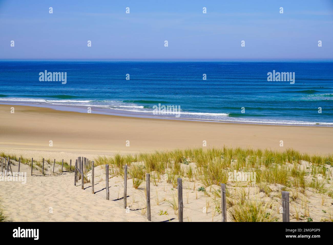 beach sea access in sandy dunes and fence of atlantic ocean waves at le ...