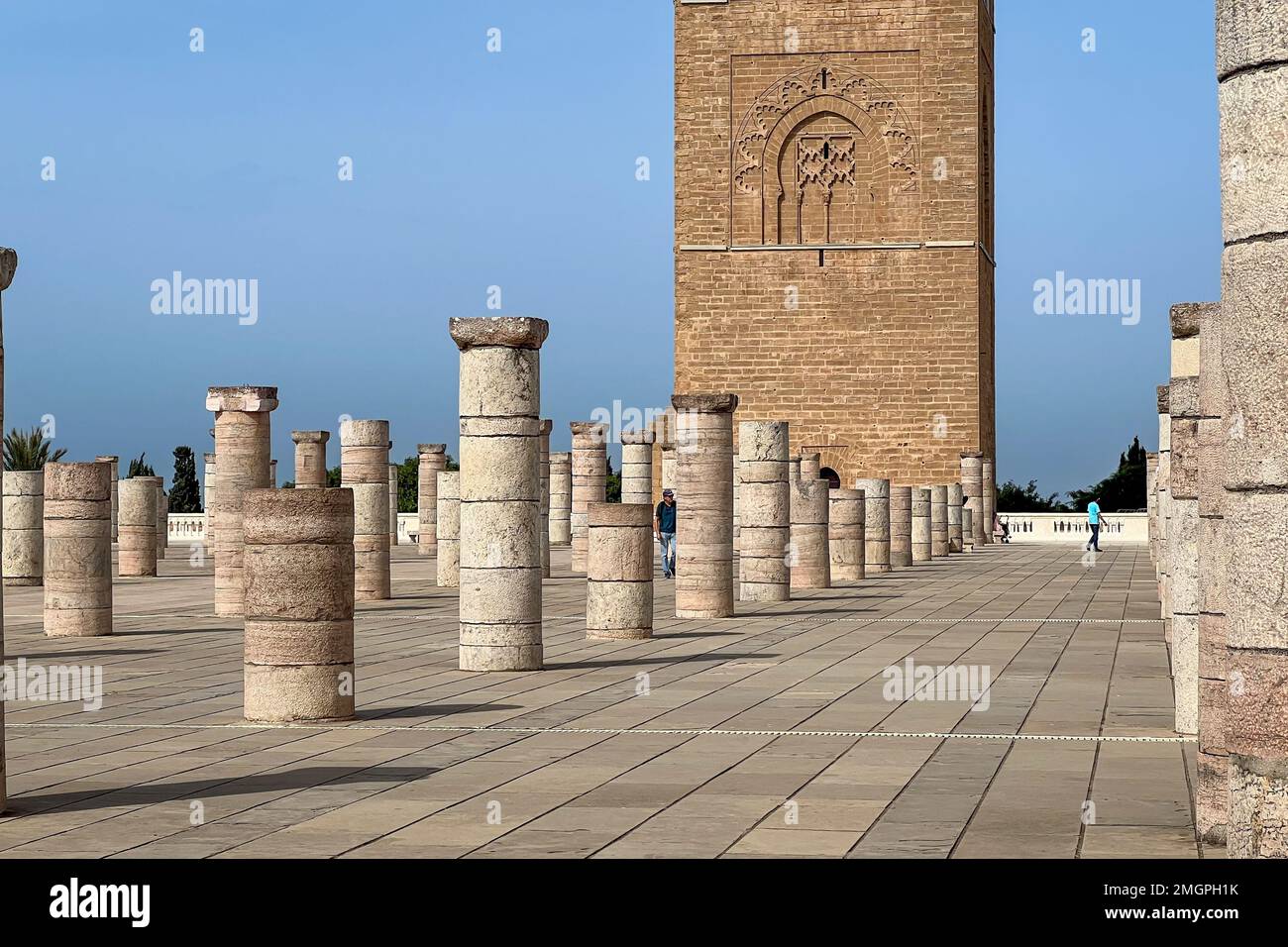 People visiting the Hassan Tower and the columns in Rabat, Morocco ...