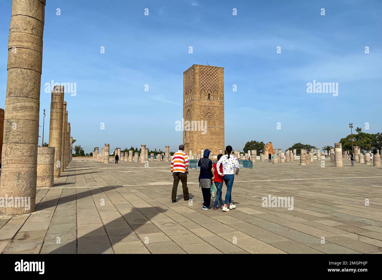 People visiting the Hassan Tower and the columns in Rabat, Morocco ...