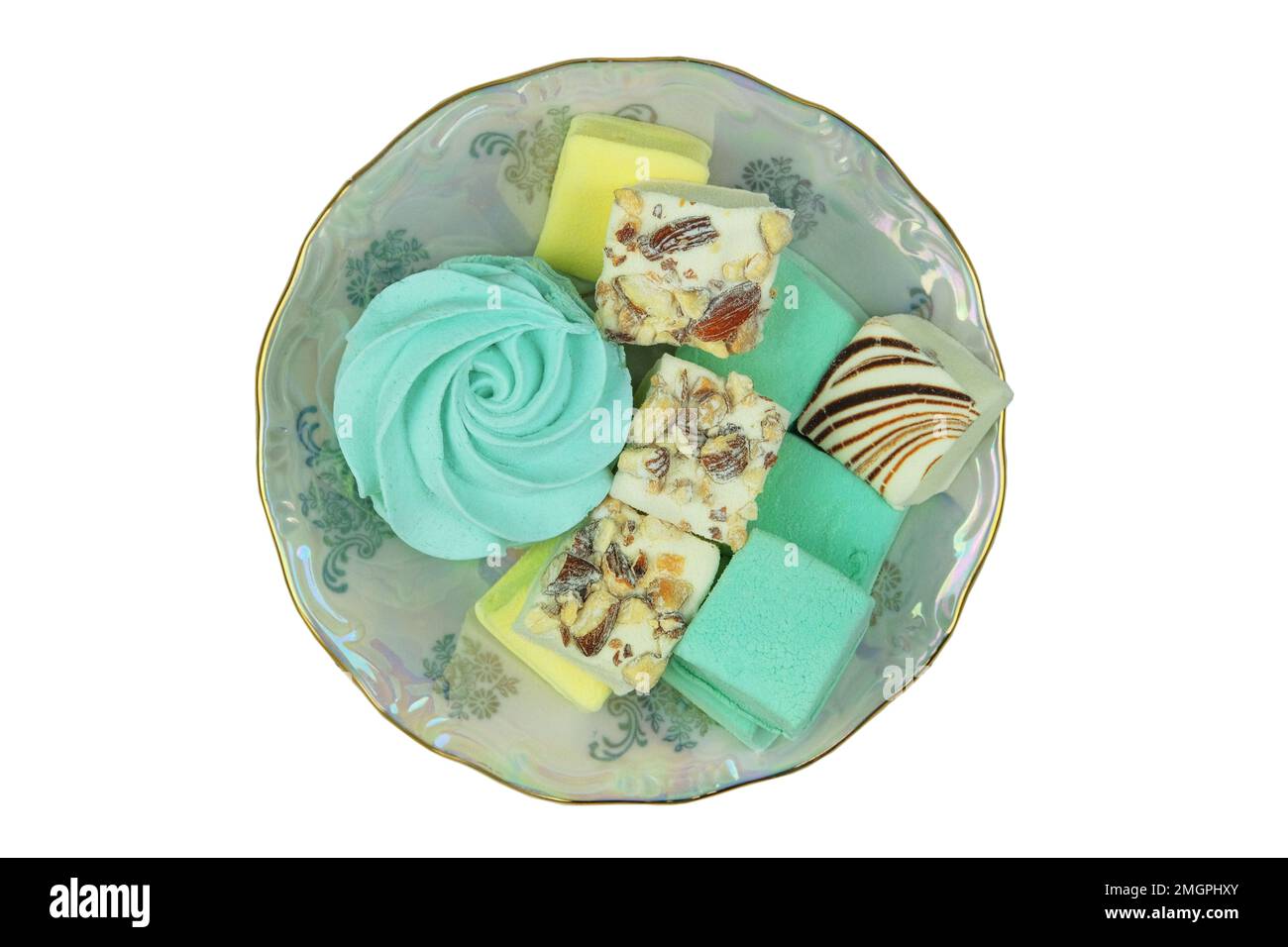 Sweet desserts in plate for the holiday. Marshmallows and macaroons in ...
