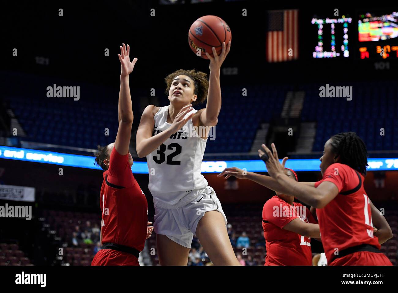 Central Florida's Brittney Smith shoots between Cincinnati's Angel ...