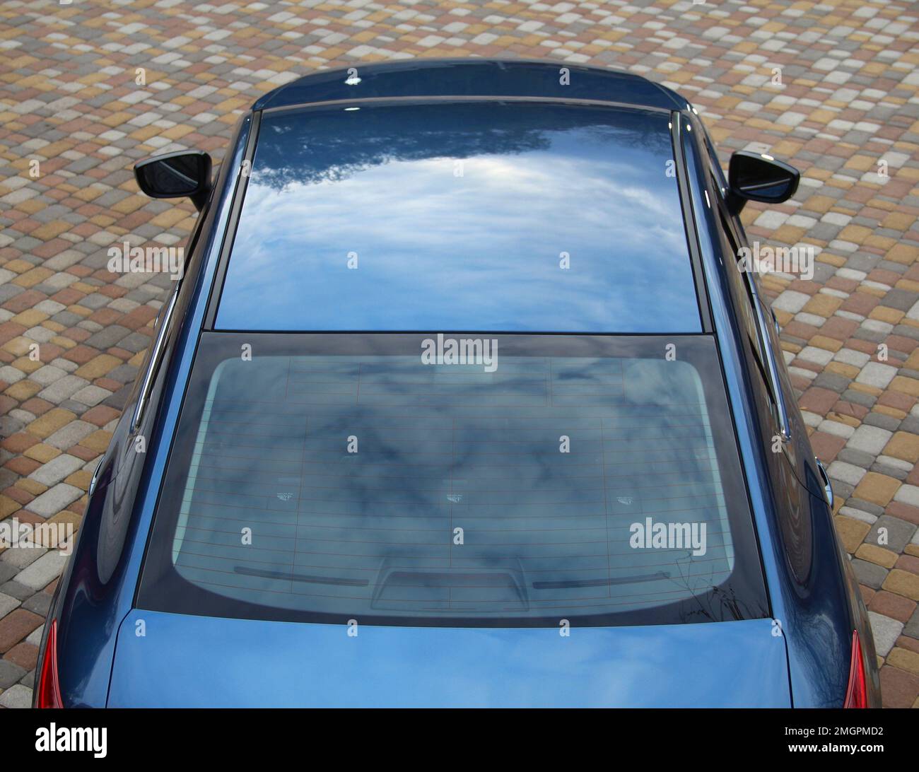 Ongoing View From Above On The Roof Of Blue Car Stock Photo - Alamy