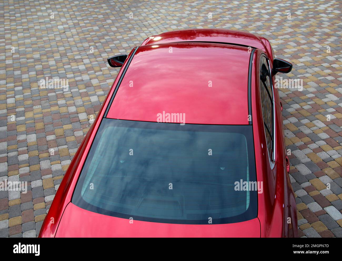 Ongoing View From Above On Red Vehicle Staying On Pavement Stock Photo ...