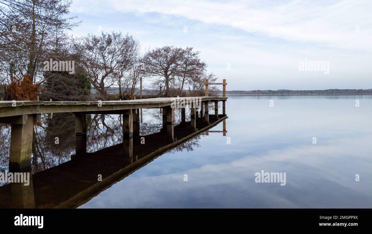 wooden pontoon on morning sunrise on Lake Léon in Landes leon france ...