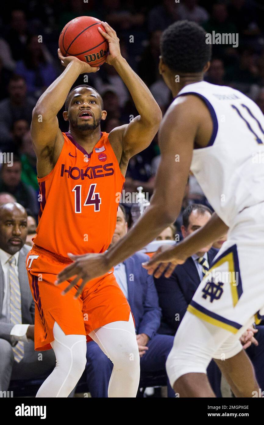 Virginia Tech's P.J. Horne (14) shoots a 3-pointer in front of Notre ...
