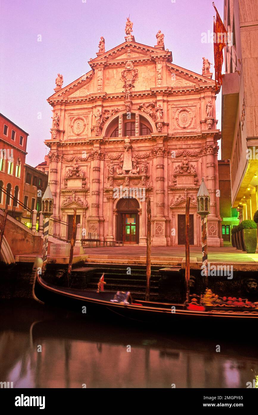 Italy, Venice, the church of San Moise, Baroque facade with gondola ...
