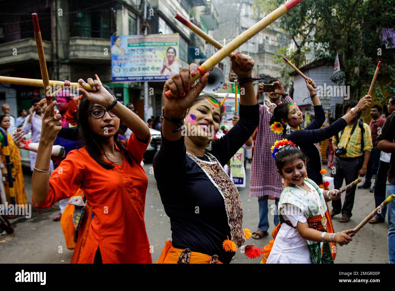 Schoolchildren dance in a procession to celebrate the spring festival ...