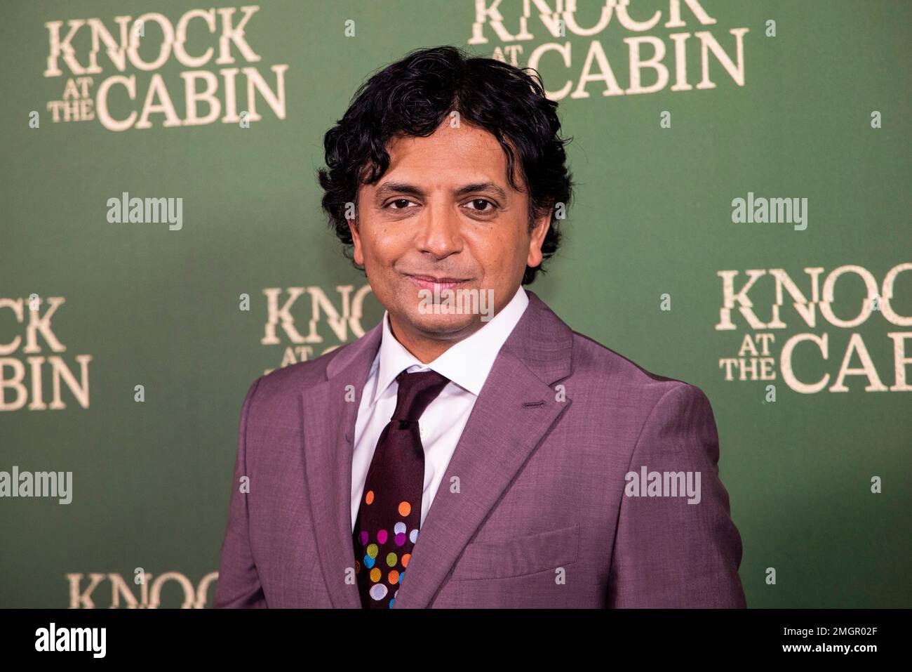 Director M. Night Shyamalan poses for photographers upon arrival at the ...