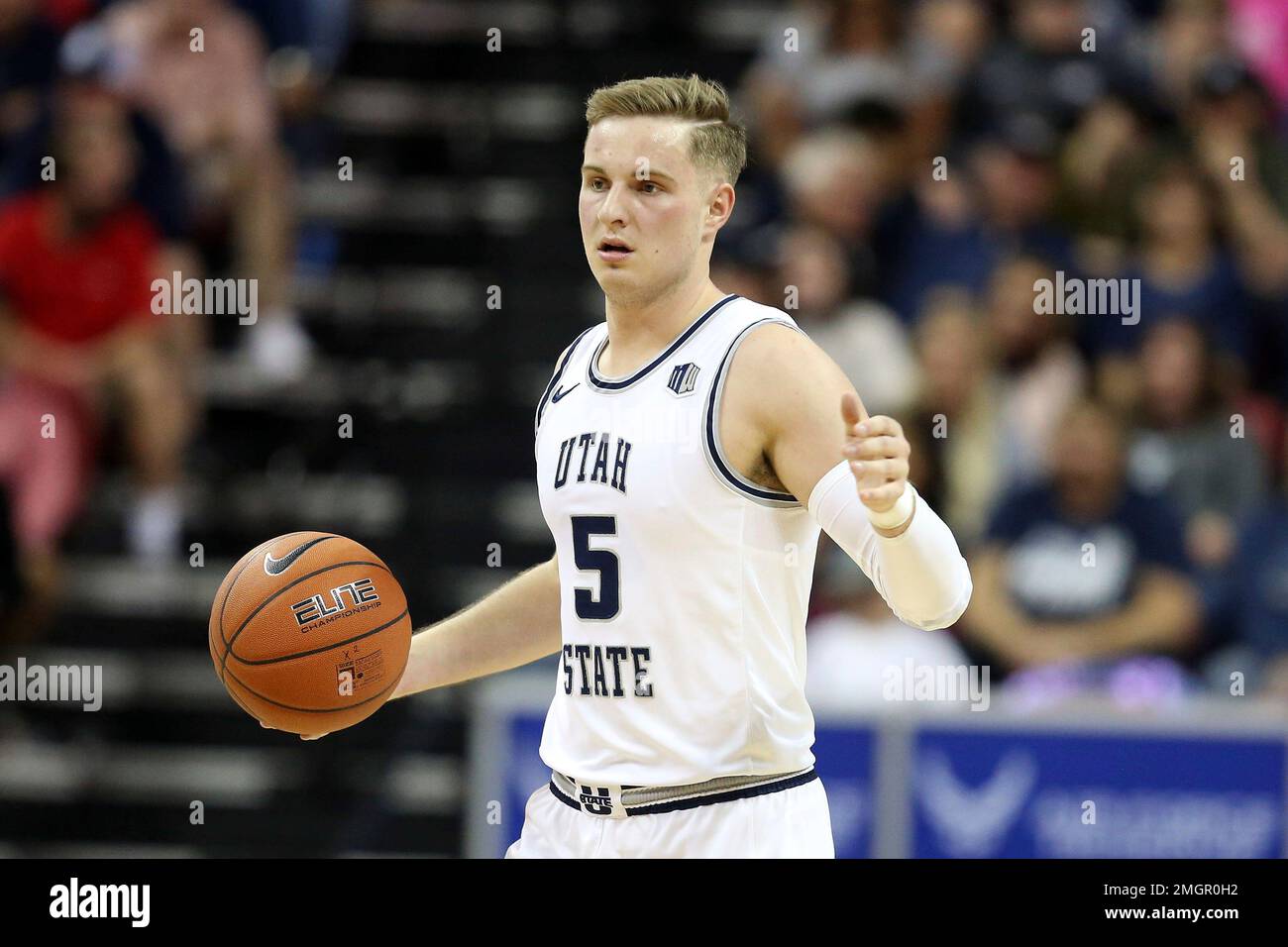 Utah State's Sam Merrill plays against Wyoming during the first half of ...