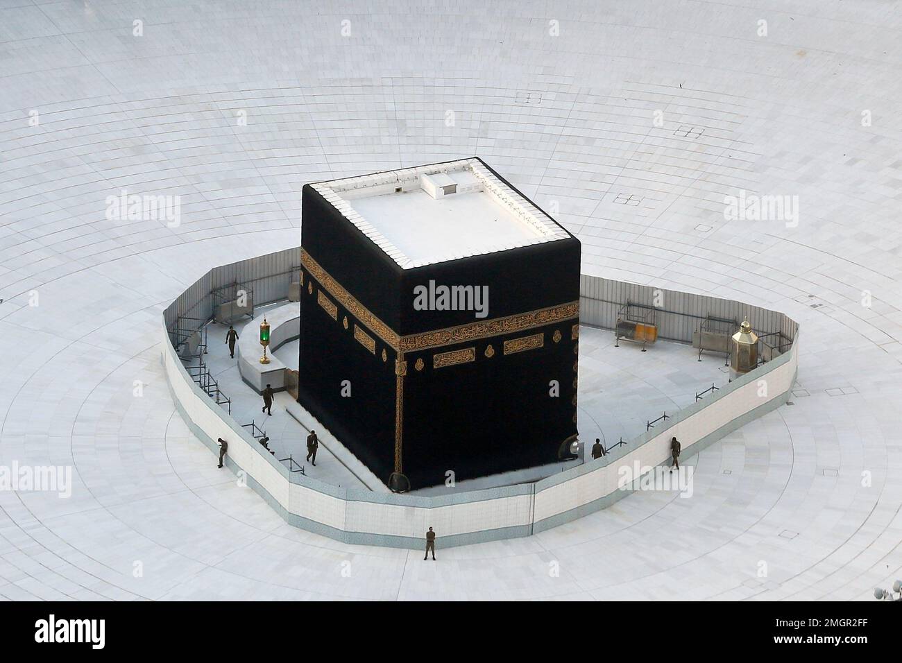 Police guard the the Kaaba, the cube building at the Grand Mosque, in ...