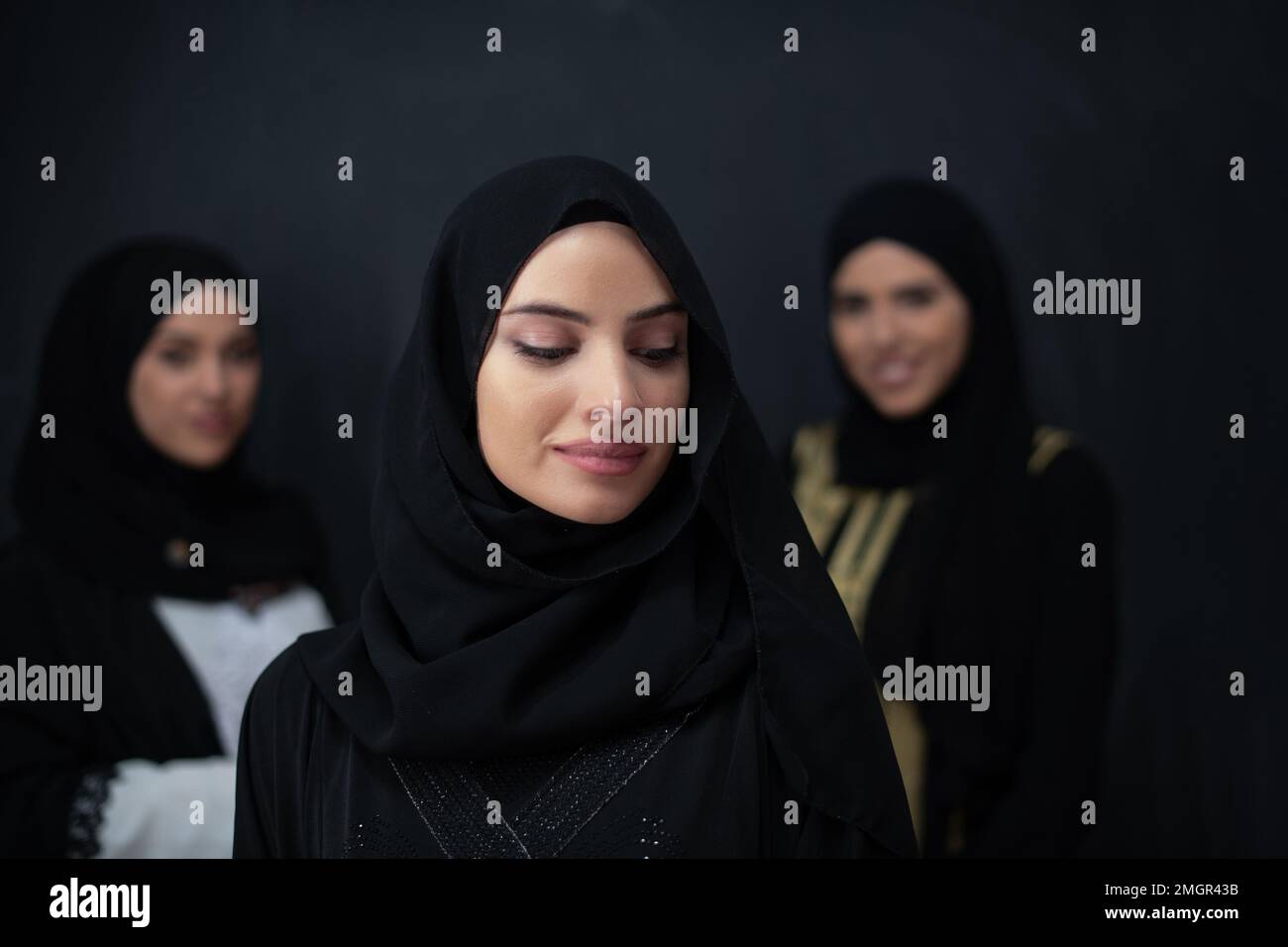 Group portrait of beautiful Muslim women in a fashionable dress with ...