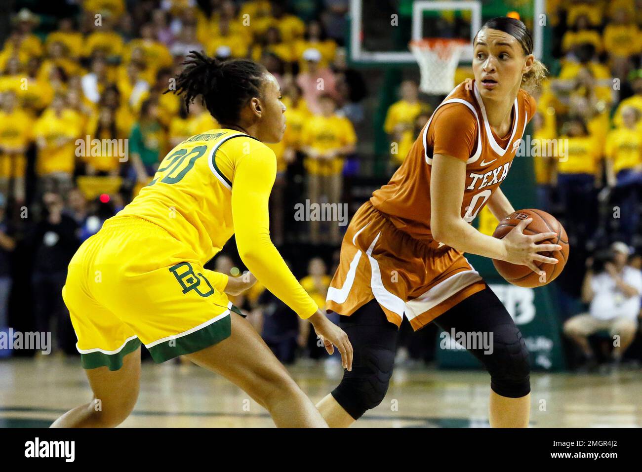Texas guard Celeste Taylor, right, looks over the defense of Baylor ...