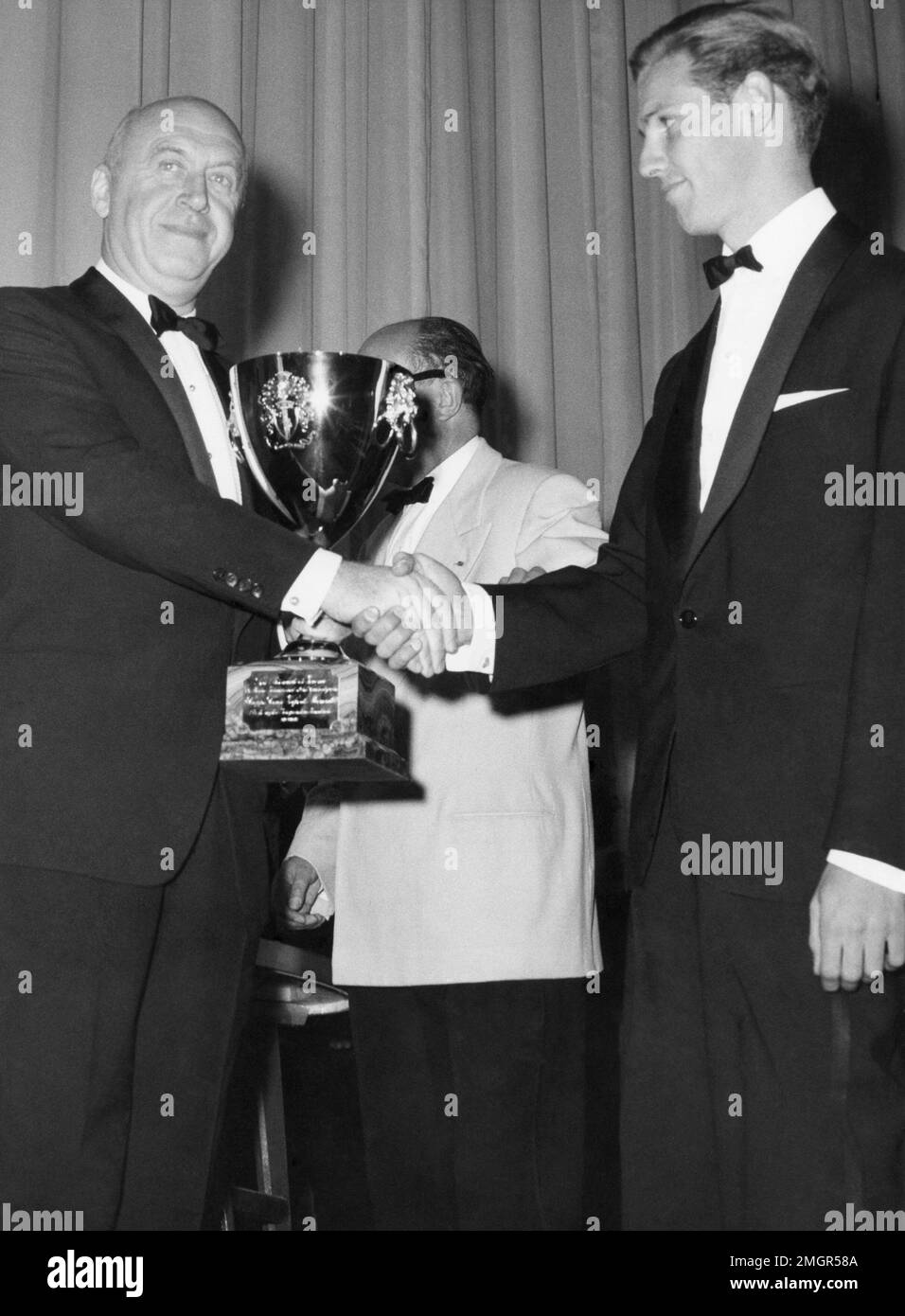 American director Otto Preminger, left, shakes hands with Italian Count ...