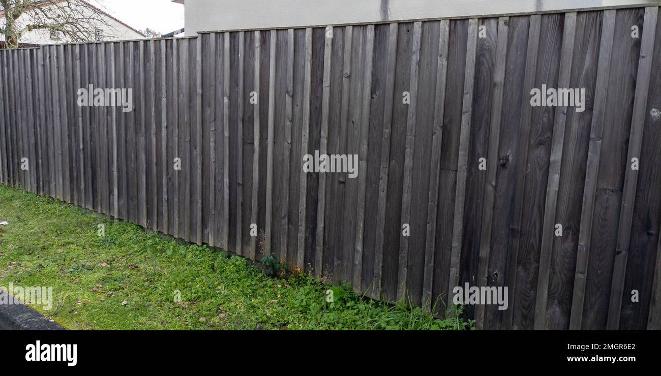 wall street wooden brut fence barrier around private house protect raw ...