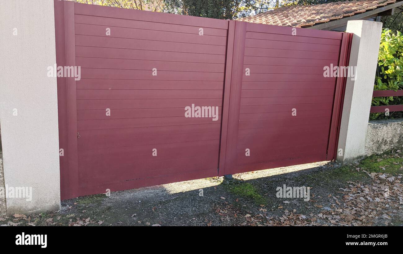 Aluminum large dark red metal gate of suburb house steel door Stock ...