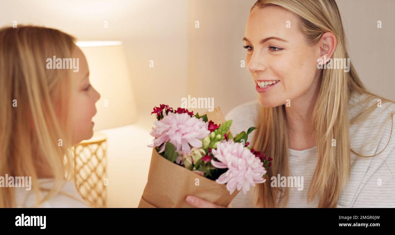 Flowers, gift and happy with mother and girl for mothers day, birthday ...