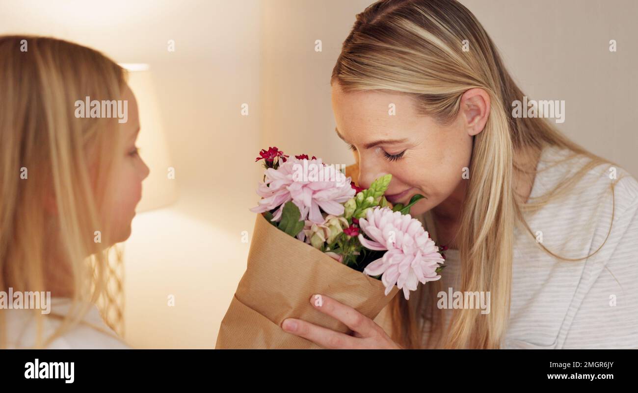 Daughter giving mother flowers hi-res stock photography and images - Alamy