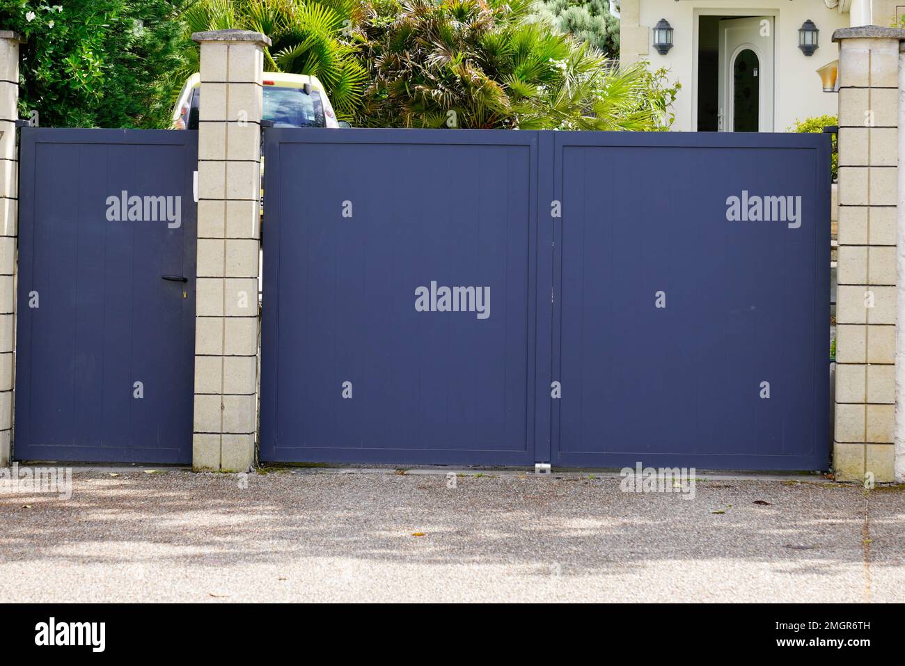 door home access aluminum gray gate and portal of suburb house Stock ...