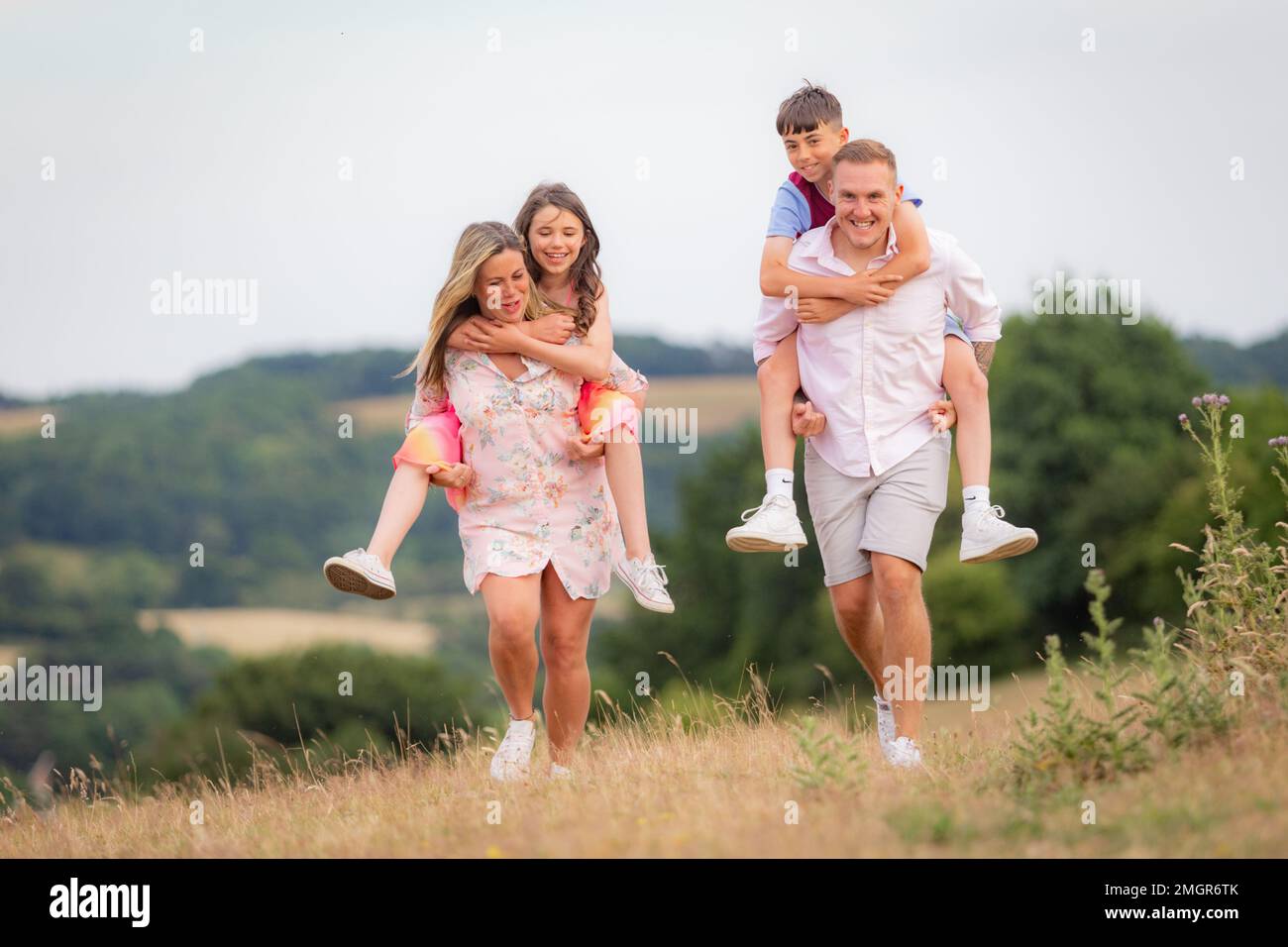 Family having playful fun outside Stock Photo - Alamy