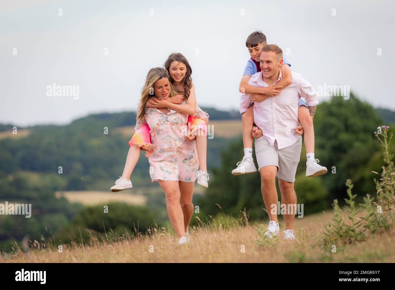 Happy father mother children outside hi-res stock photography and ...