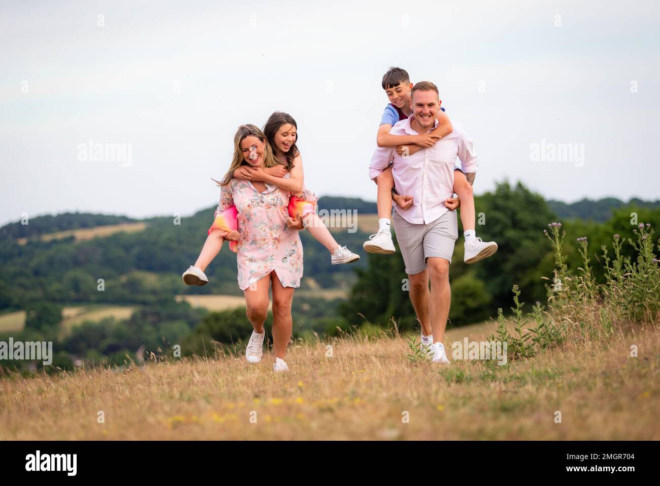 Family having playful fun outside Stock Photo - Alamy