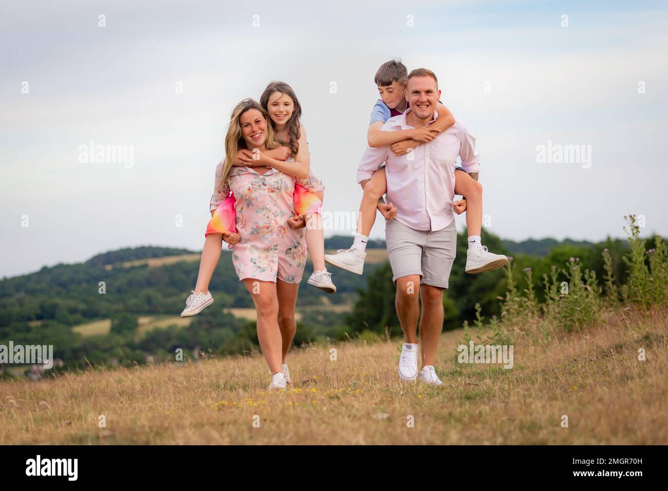 Family having playful fun outside Stock Photo - Alamy